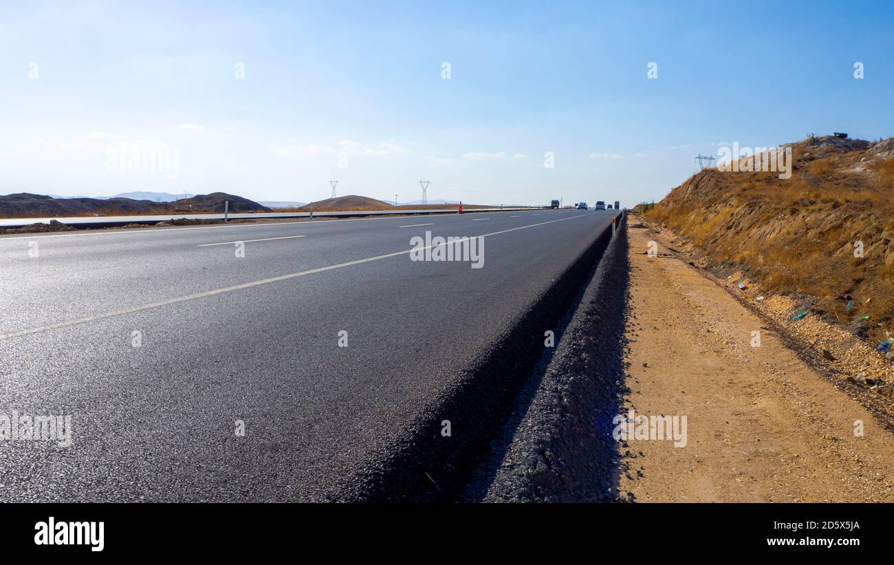 newly built asphalt road highway and vehicles long asphalt road Stock ...