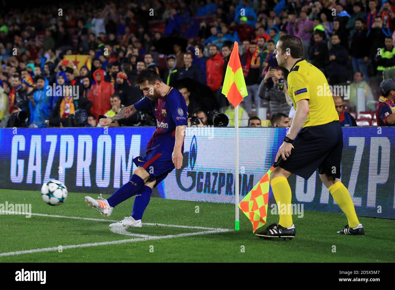 Barcelona's Lionel Messi takes a corner as Conservative MP Douglas Ross ...