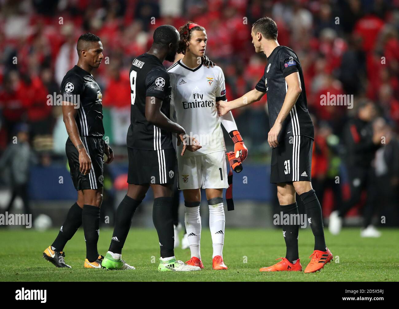 Benfica goalkeeper Mile Svilar (centre) is consoled by Manchester ...