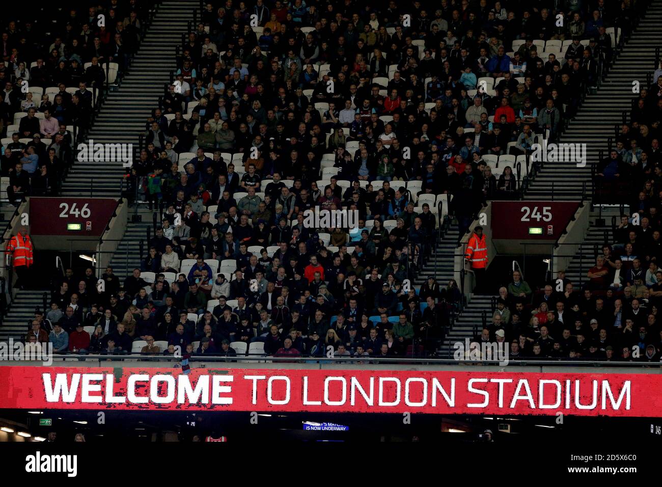 West Ham United fans in the stands above a 'Welcome To London Stadium ...