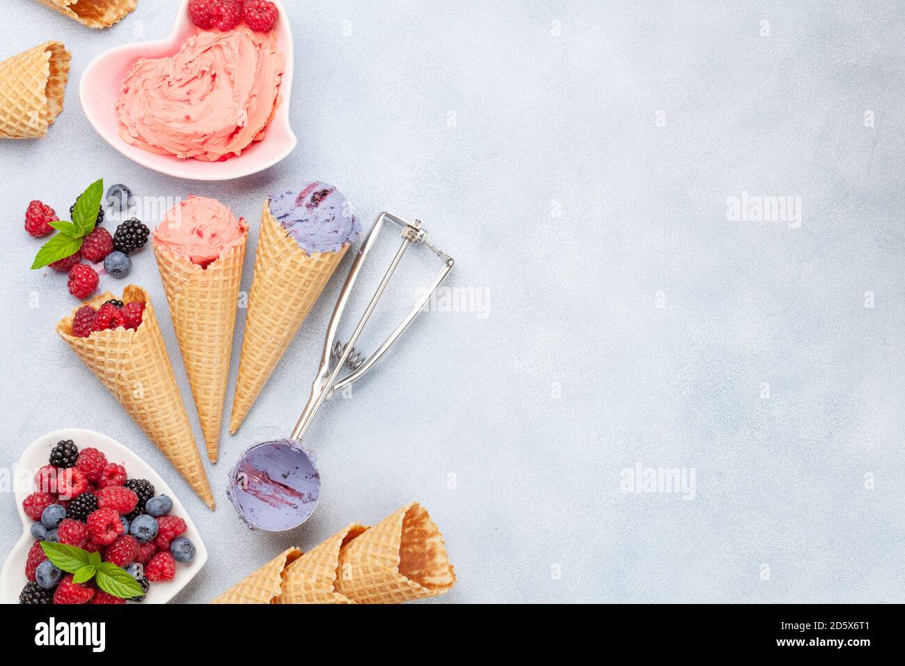 Homemade berry and vanilla ice cream sundae. Top view flat lay with ...