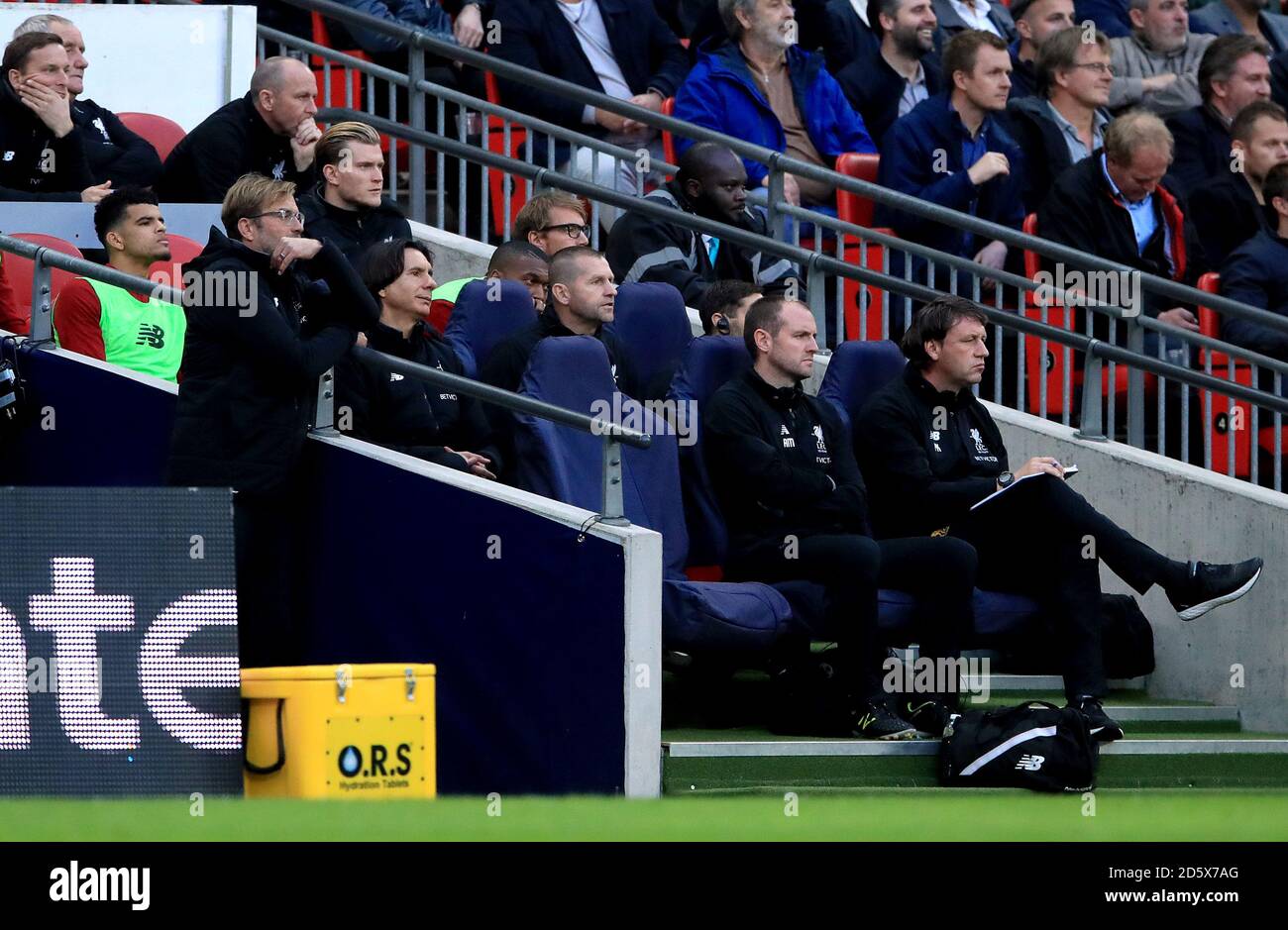 Liverpool manager Jurgen Klopp (left) appears dejected as he leans ...