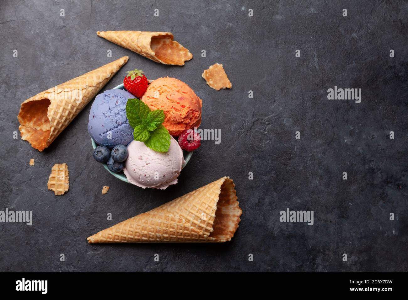 Berry and vanilla ice cream sundae. Top view flat lay with copy space ...