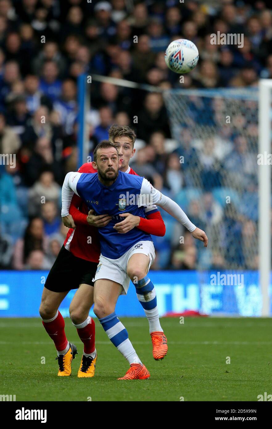 Sheffield Wednesday's Steven Fletcher (right) and Barnsley's Angus ...