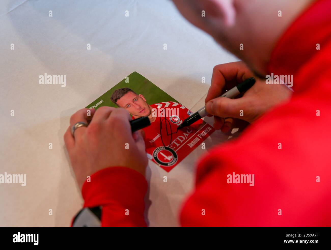 Charlton Athletic's Jason Pearce signs autographs in the club shop ...