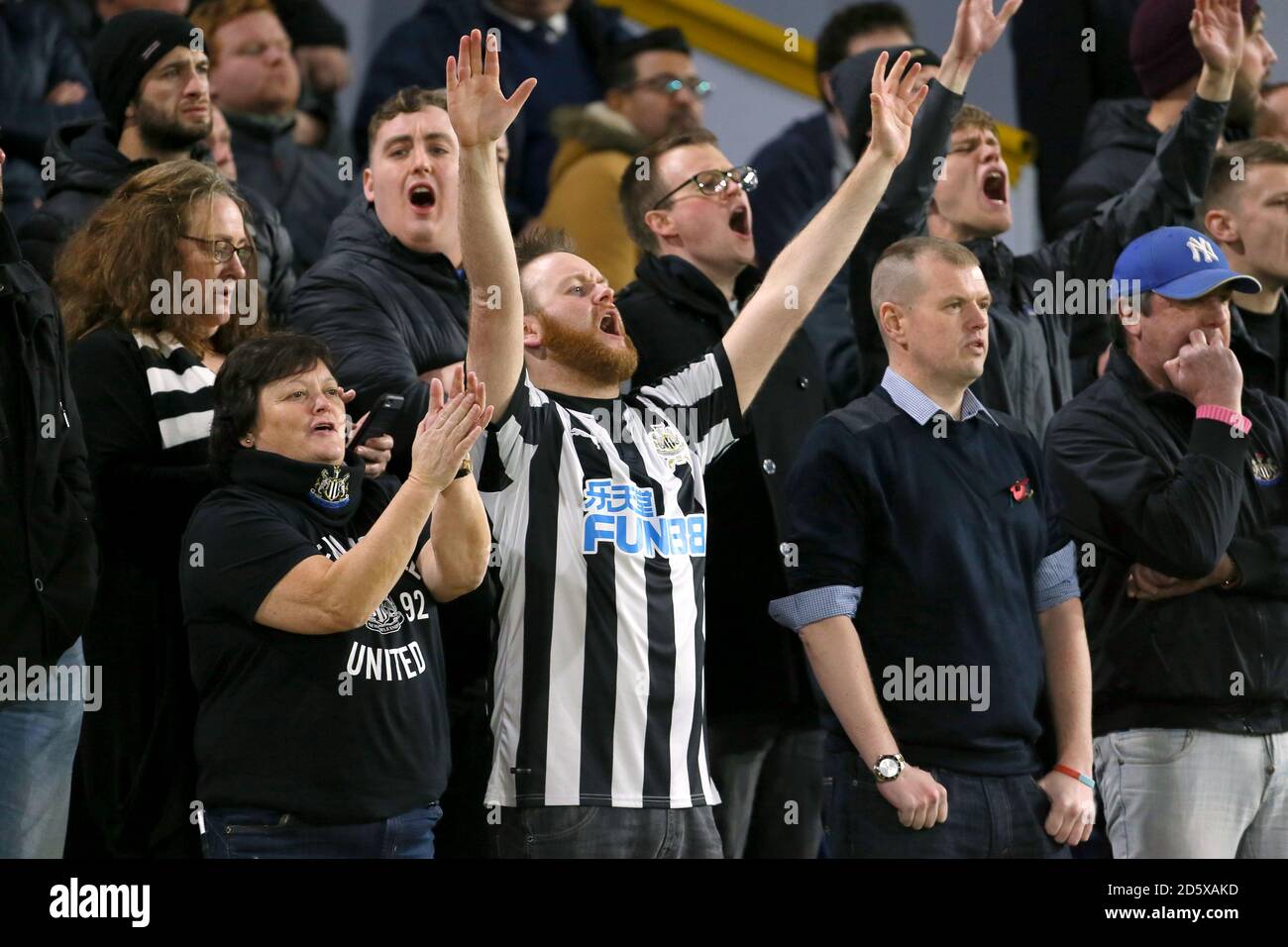 Newcastle fans in the stands Stock Photo - Alamy