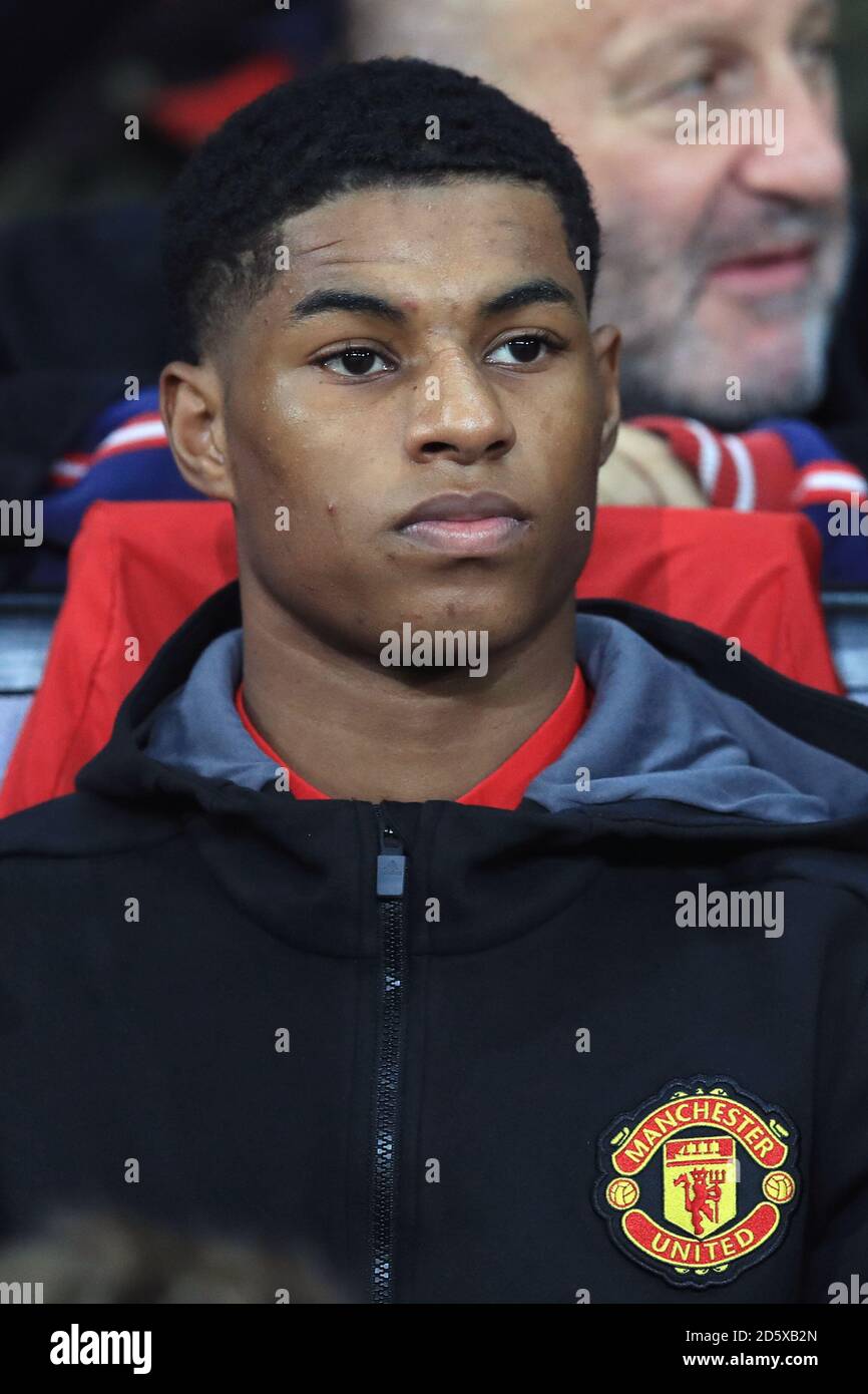 Manchester United's Marcus Rashford watches from the substitute bench ...