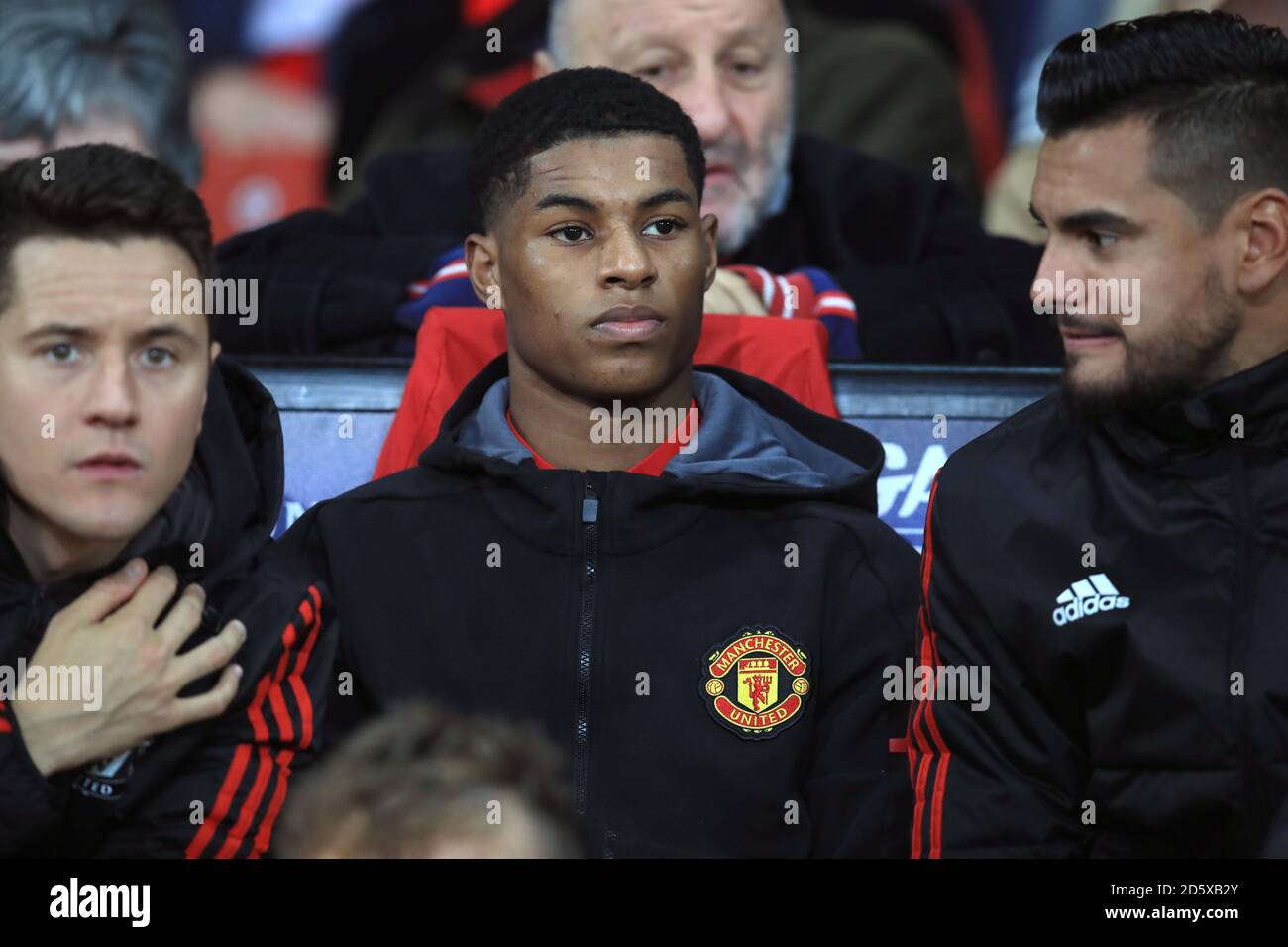 Manchester United's Marcus Rashford watches from the substitute bench ...