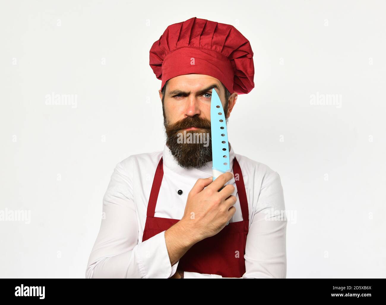 Man with beard in cook uniform isolated on white background. Cooking ...