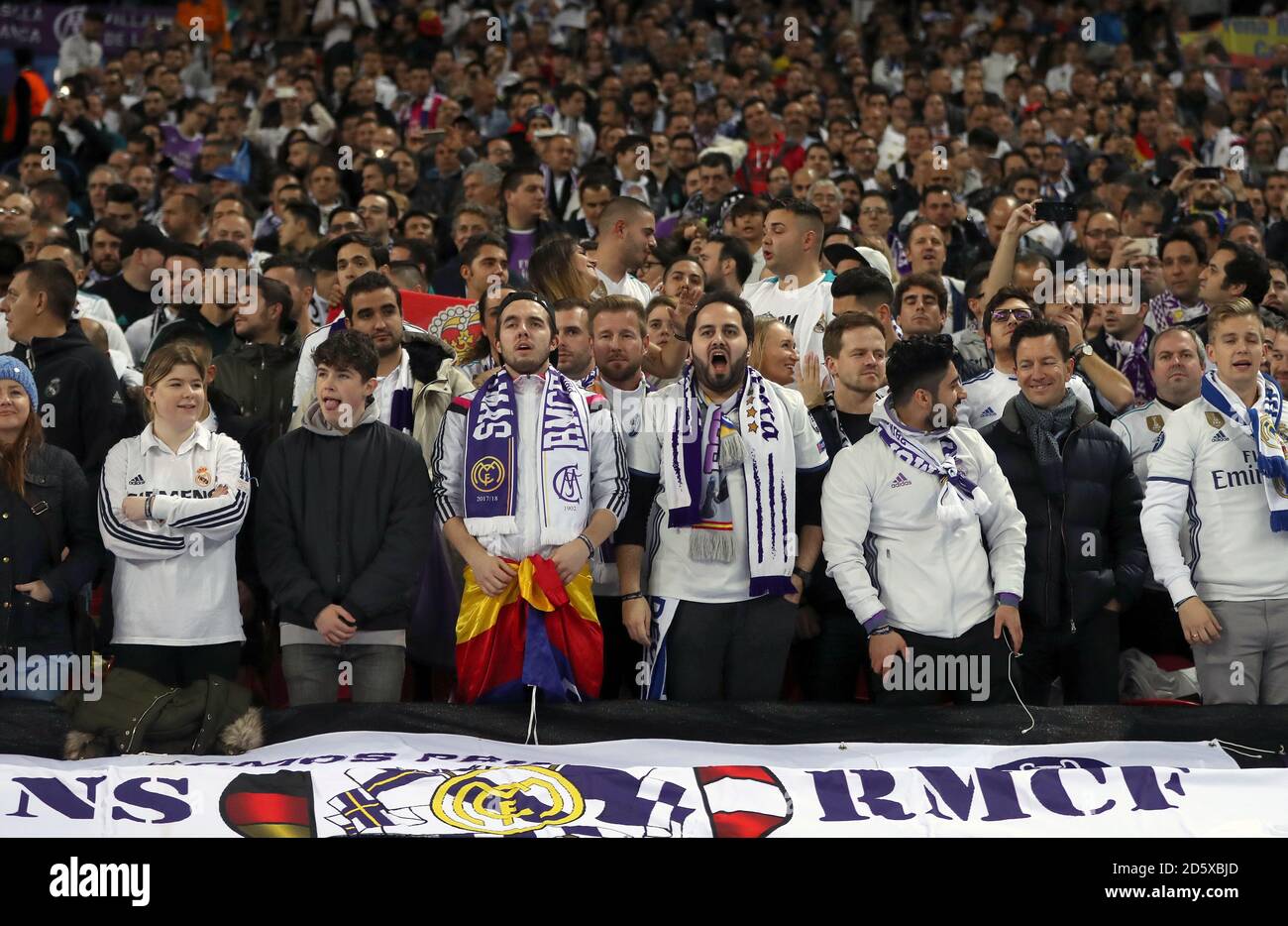 Real madrid fans in the stands show their support Stock Photo - Alamy