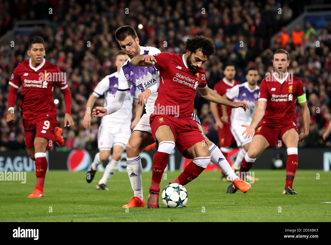 Liverpool's Mohamed Salah (right) and Maribor's Mitja Viler battle for ...