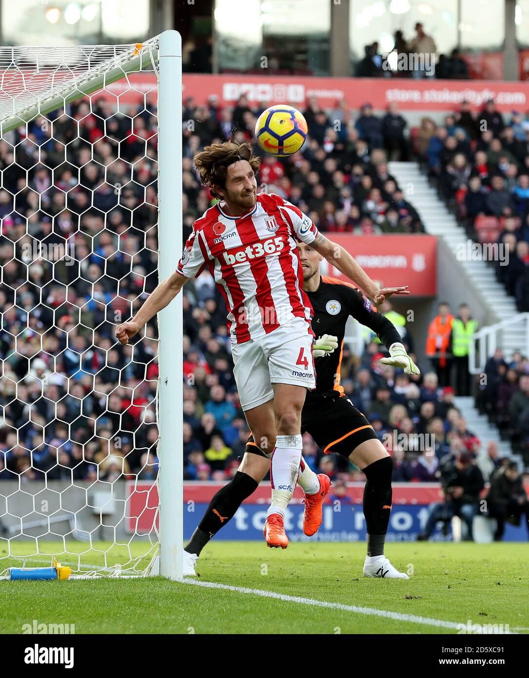 Stoke City's Joe Allen heads the ball Stock Photo - Alamy