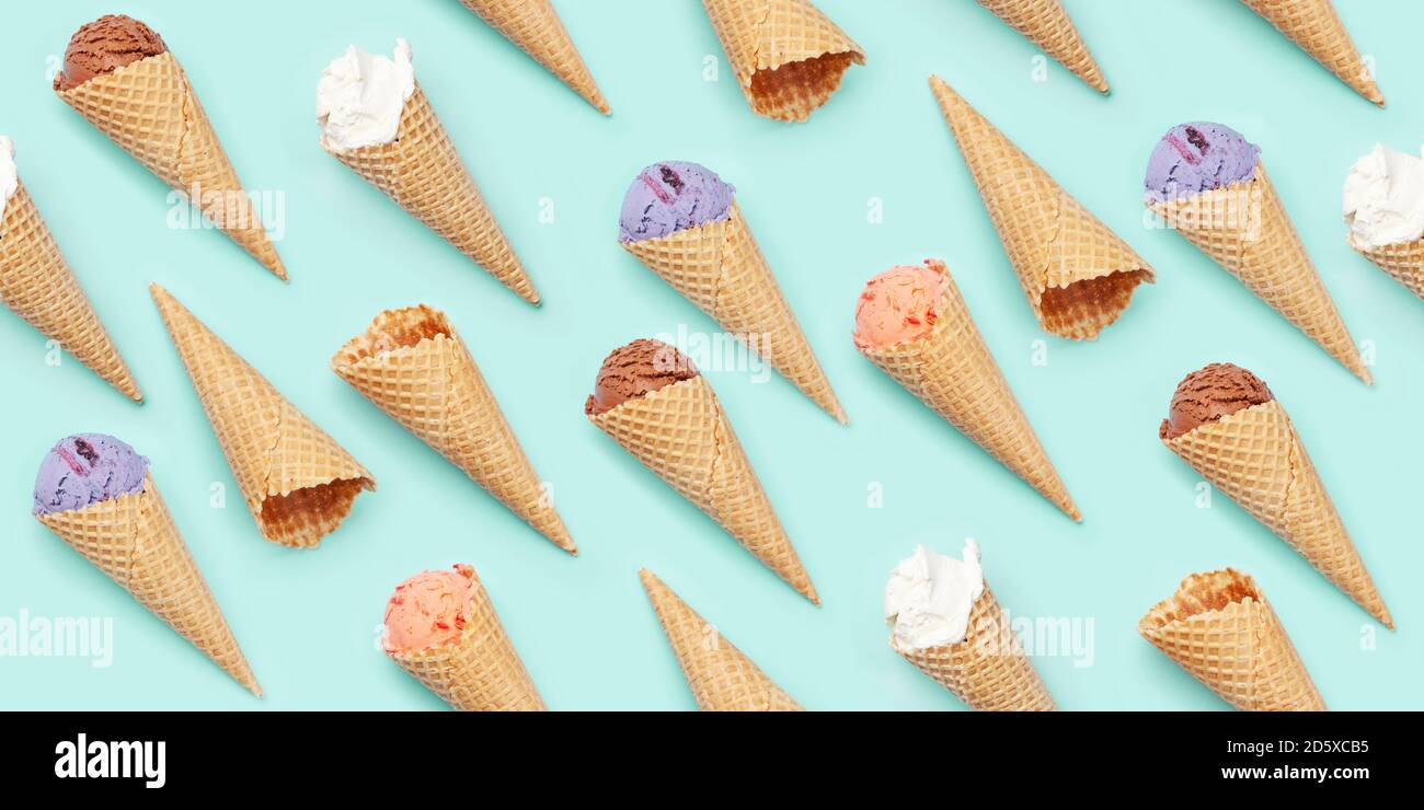 Seamless background with various ice cream over blue backdrop. Flat lay ...