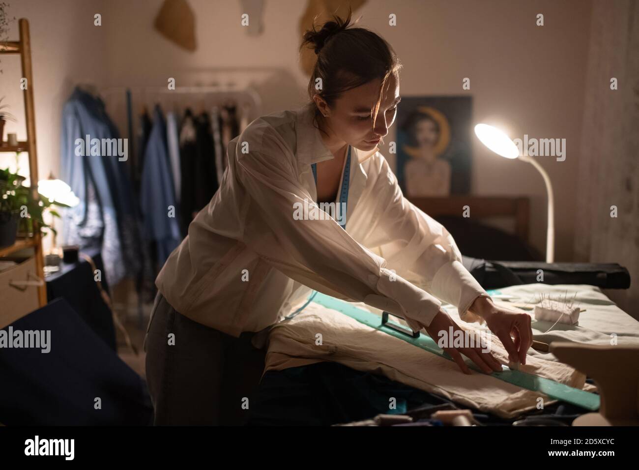 Woman with ruler hi-res stock photography and images - Alamy