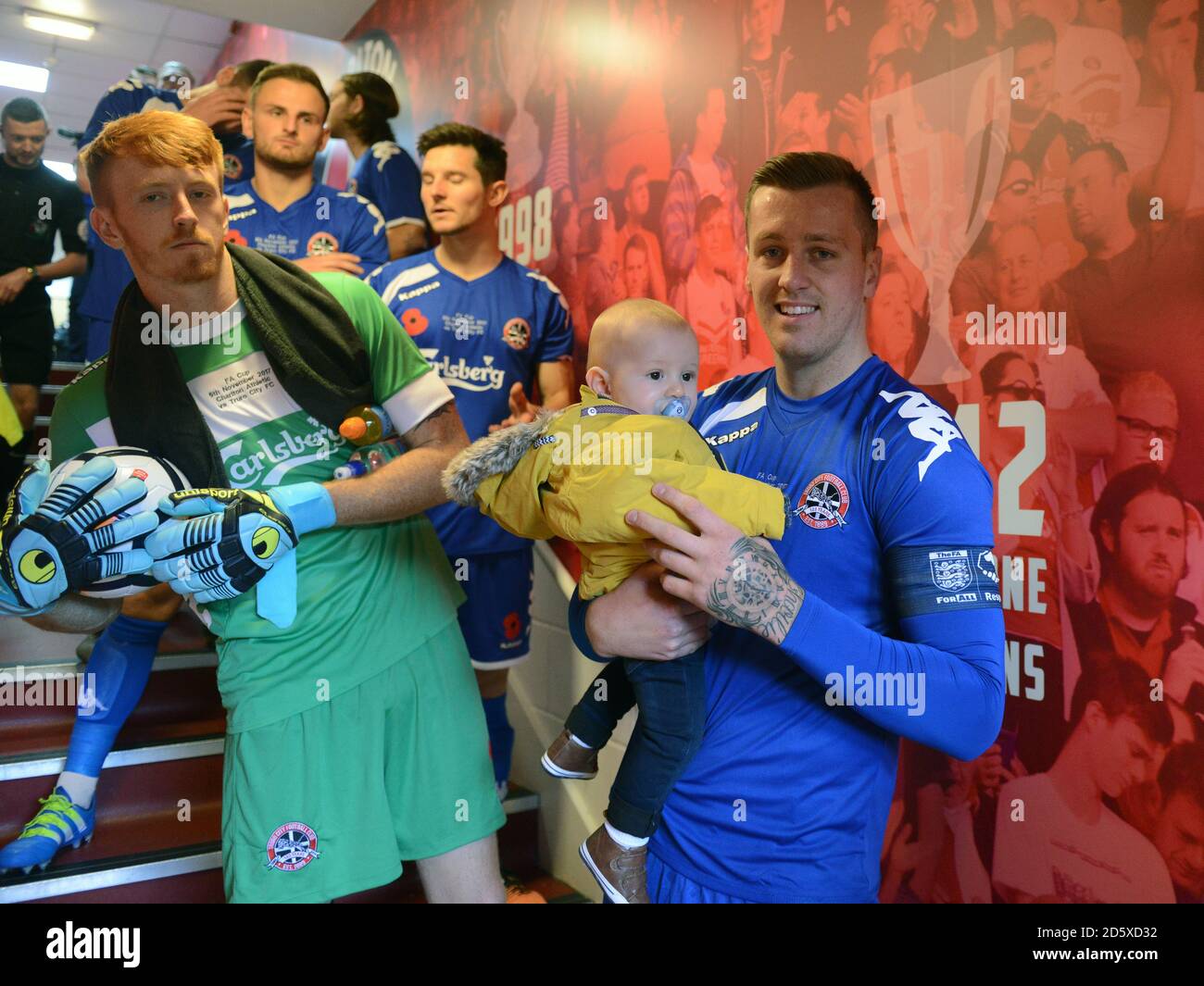 Truro City captain Ben Gerring (with his young child) in the tunnel ...