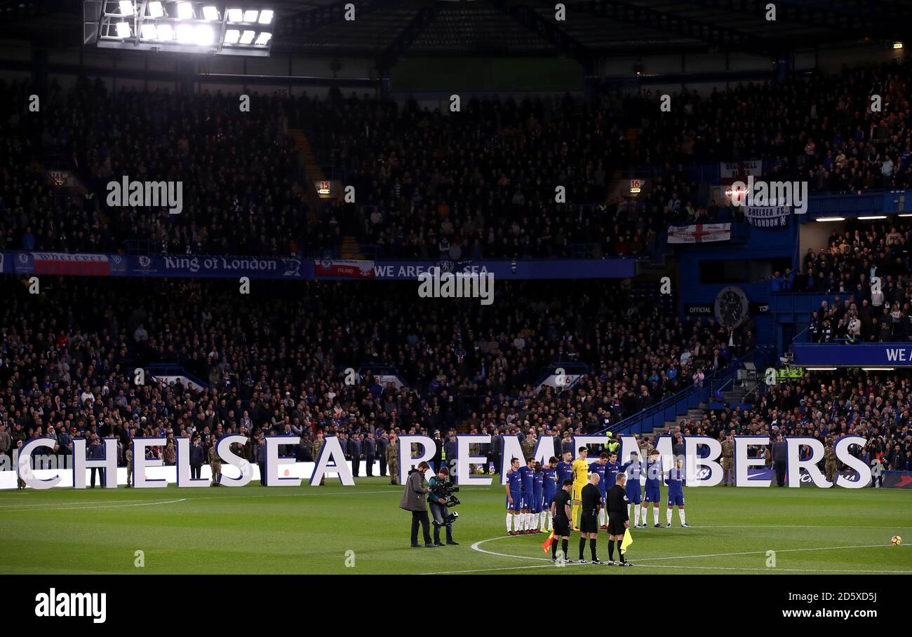 Chelsea players and members of the armed forces observe a minute's ...
