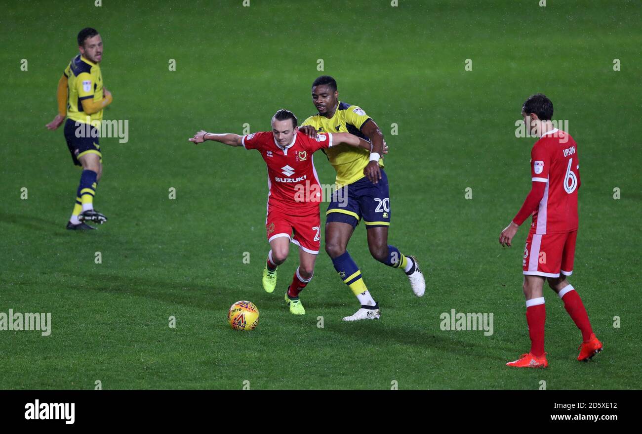 Oxford United's Jonathan Obika (right) and Milton Keynes Dons' Aidan ...