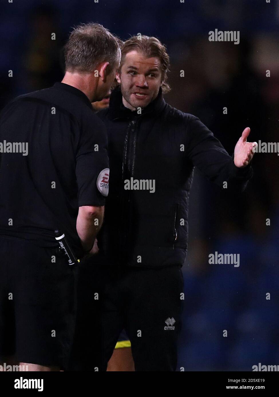 Milton Keynes Dons' Robbie Neilson (right) chats with referee Nicholas ...