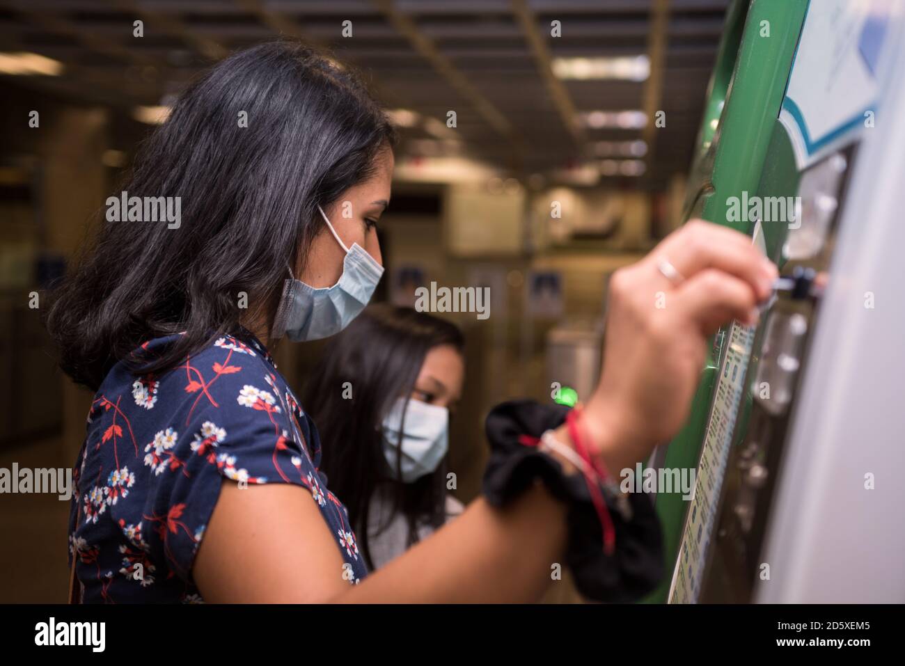Woman using vending machine hi-res stock photography and images - Alamy