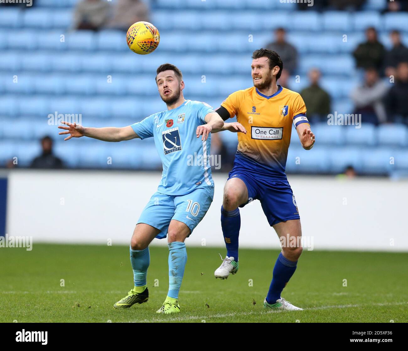 Coventry City's Marc McNulty (left) and Mansfield Town's Zander Diamond ...
