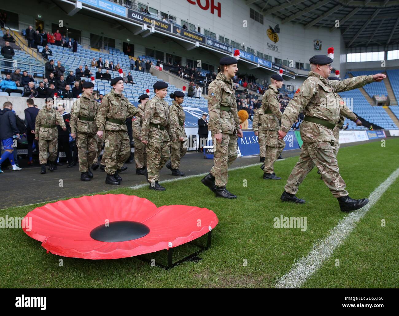 Members of the armed forces march on the pitch before Coventry City's ...