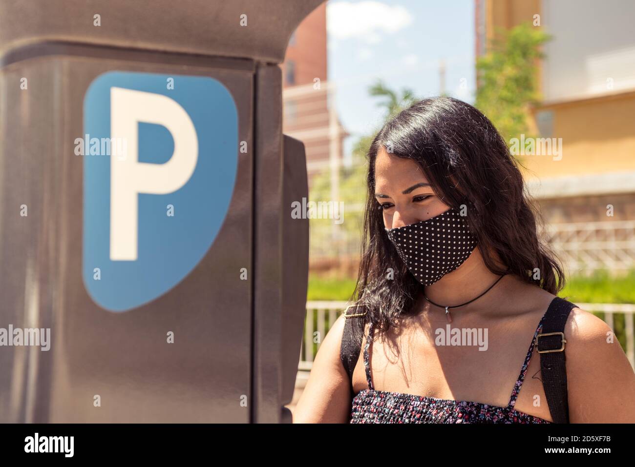 Woman using parking meter hi-res stock photography and images - Alamy