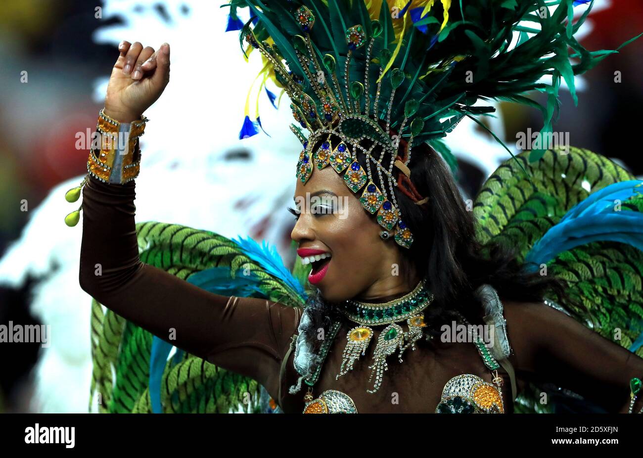 A samba dancer provides pre-match entertainment prior to the match ...