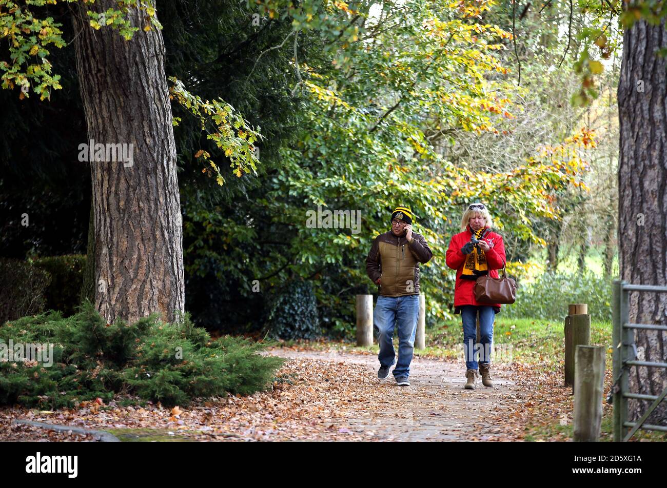 Fans make their way to Fetcham Grove prior to the match Stock Photo - Alamy