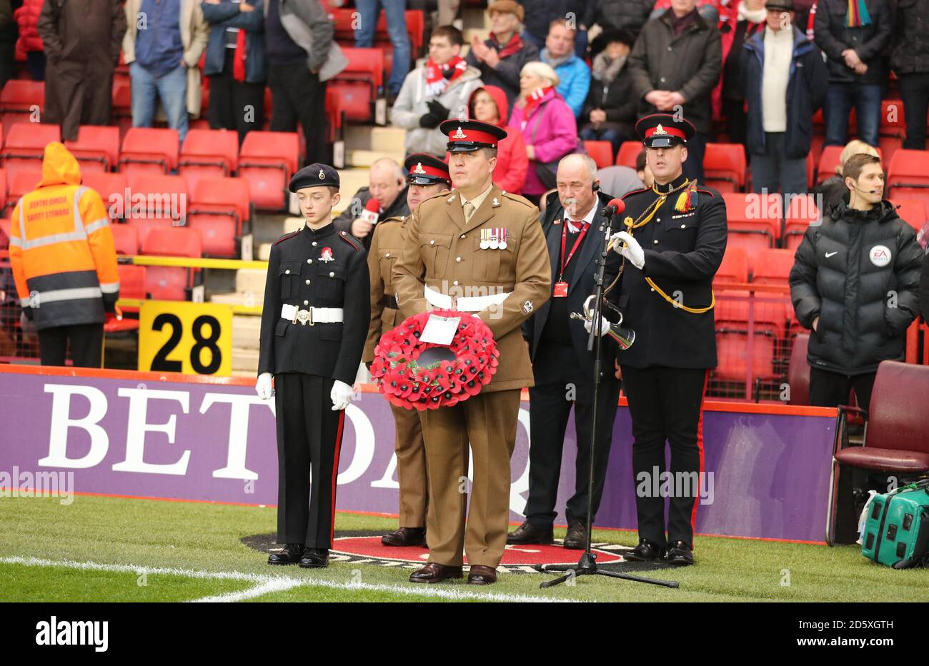 Remembrance proceeding before kick off Stock Photo - Alamy