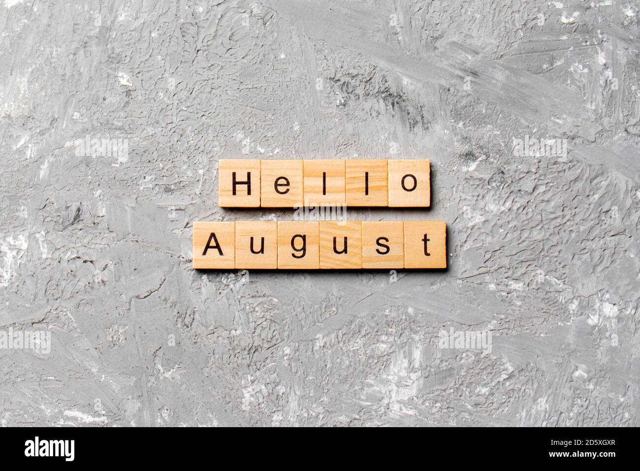 hello august word written on wood block. hello august text on table ...