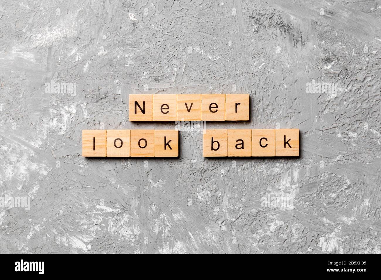 never look back word written on wood block. never look back text on ...