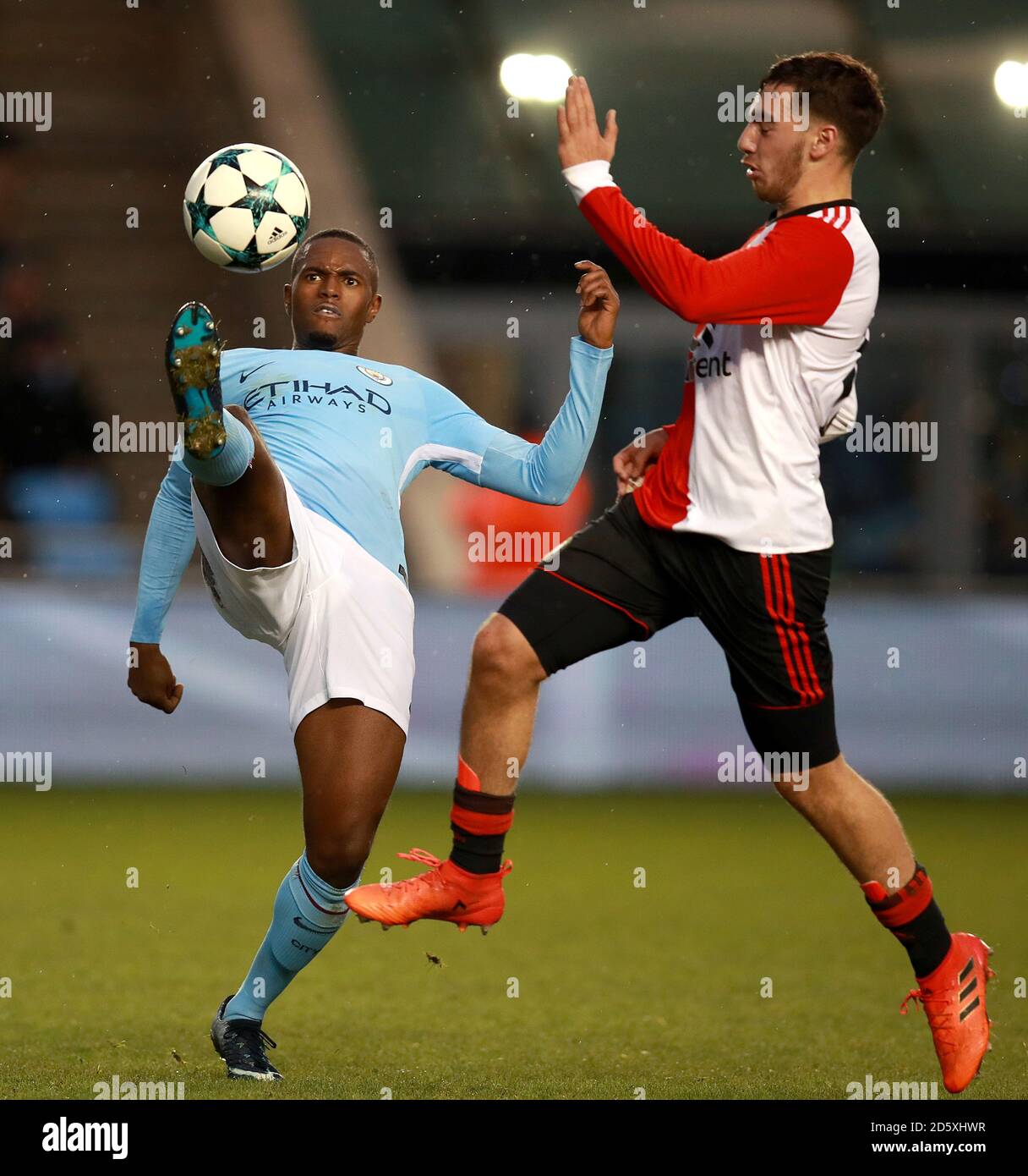 Manchester City's Sadou Diallo (left) and Feyenoord's Orkun Kokcu ...
