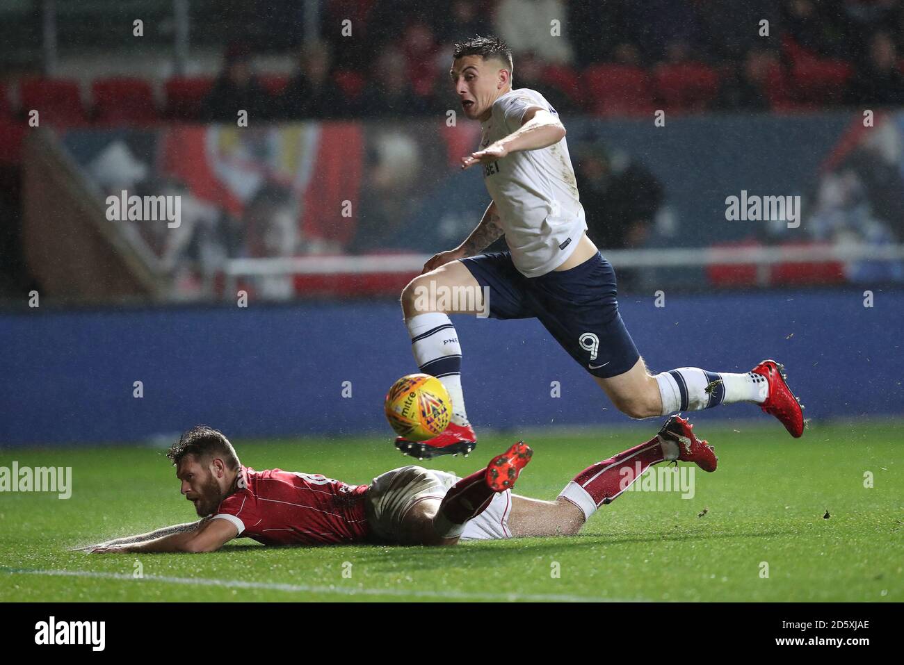 Bristol City's Nathan Baker and Preston North End's Jordan Hugill battle for the ball Stock ...