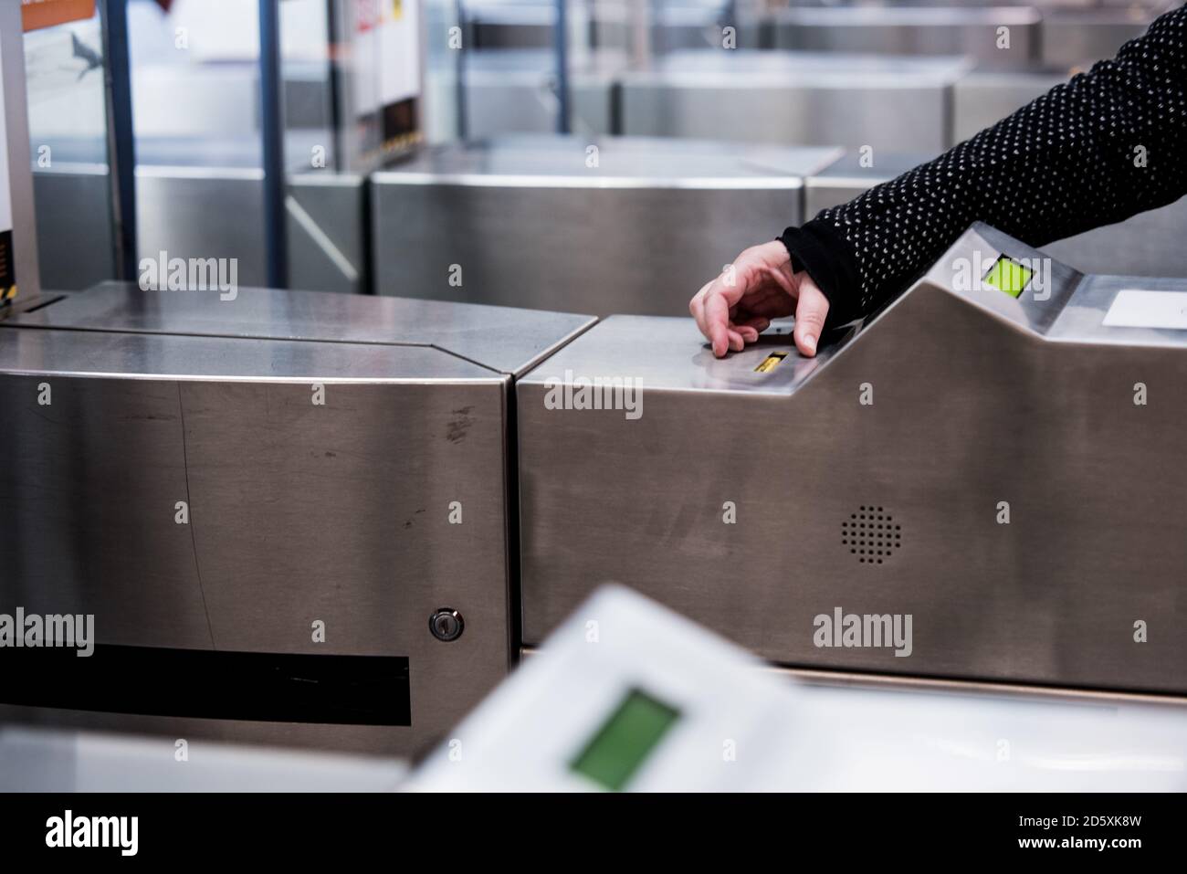 Entrance to the railway station through the turnstile. A passenger ...