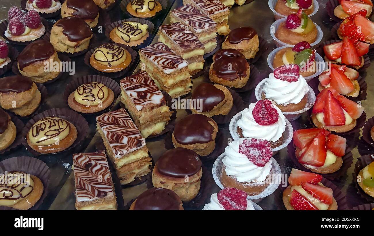 small pastries on a bakery display Stock Photo - Alamy