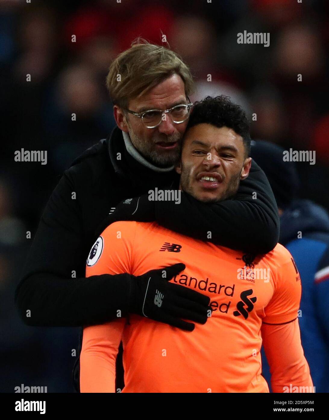 Liverpool manager Jurgen Klopp holds player Alex Oxlade-Chamberlain ...