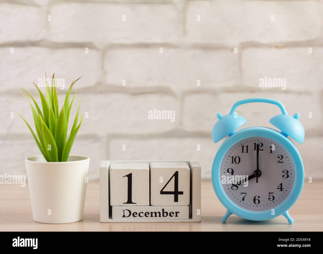December 14 on the wooden calendar next to the alarm clock, the first ...
