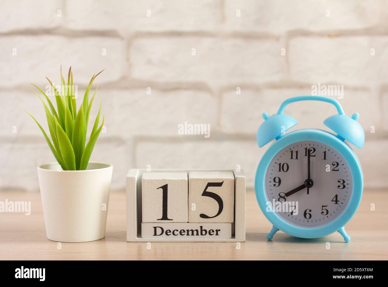 December 15 on the wooden calendar next to the alarm clock, the first ...
