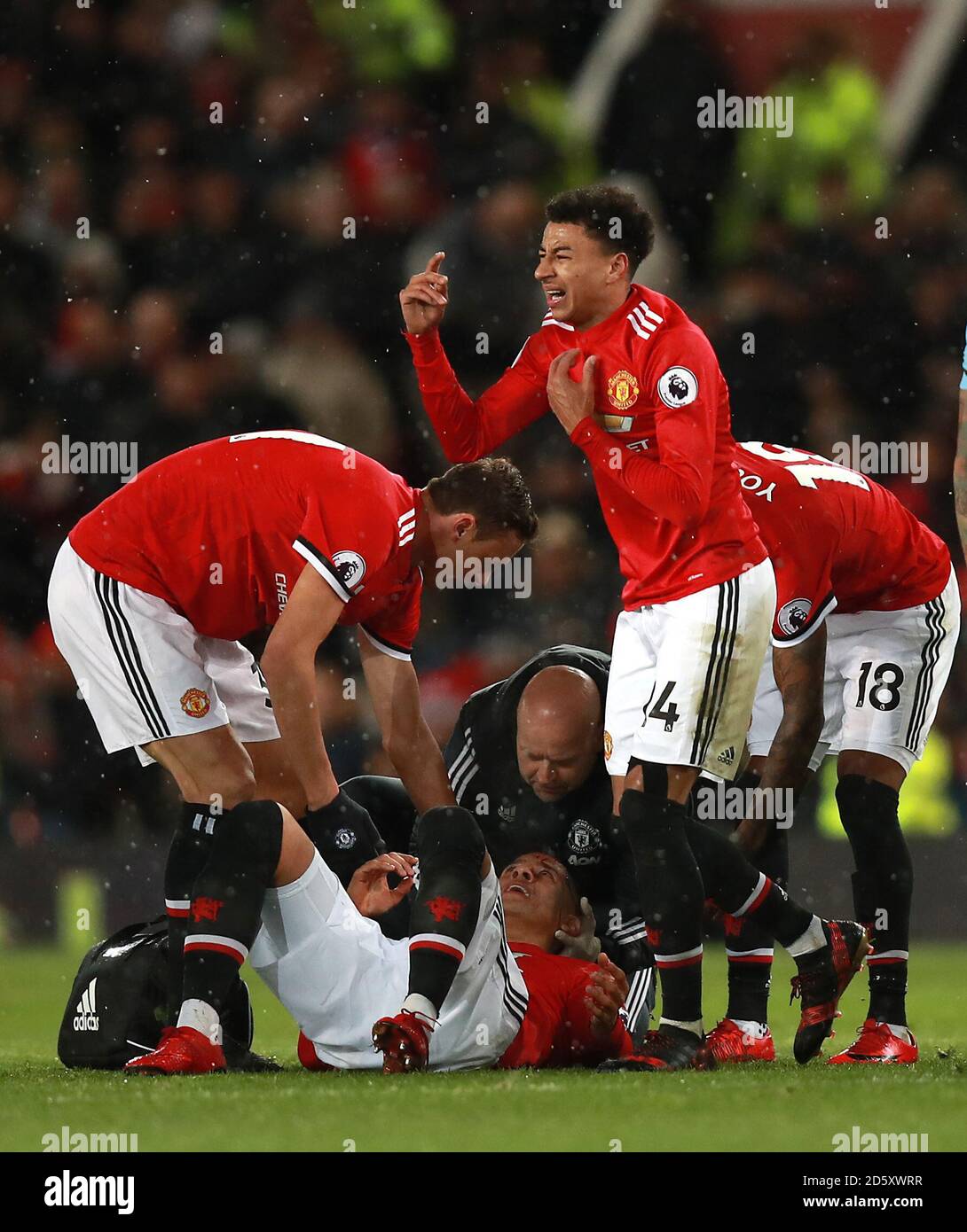 Manchester United's Marcos Rojo on the ground after picking up an ...