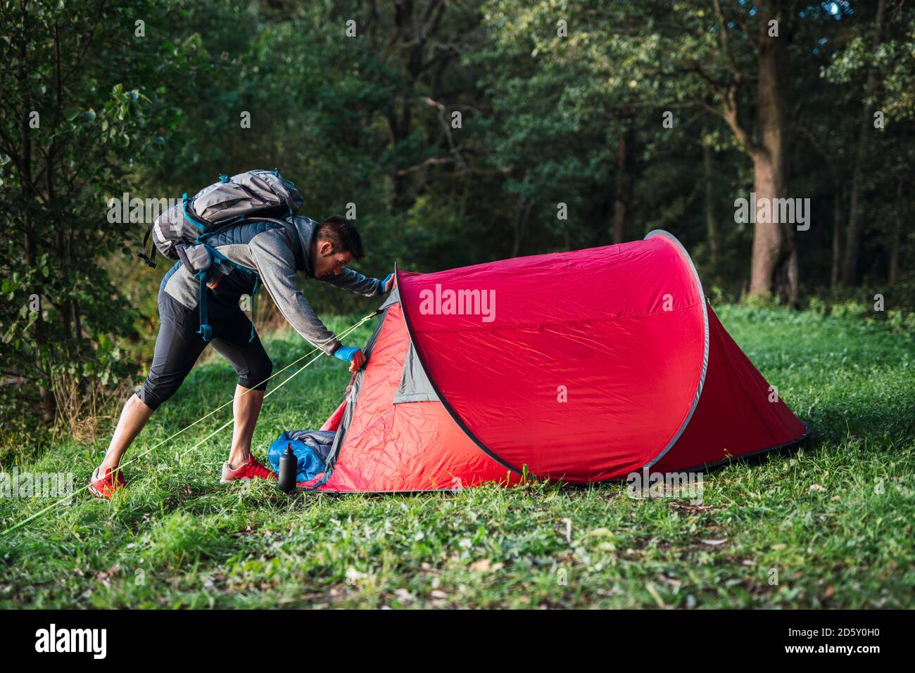 Man camping in Estonia, leaving camp with backpack for a hike Stock ...
