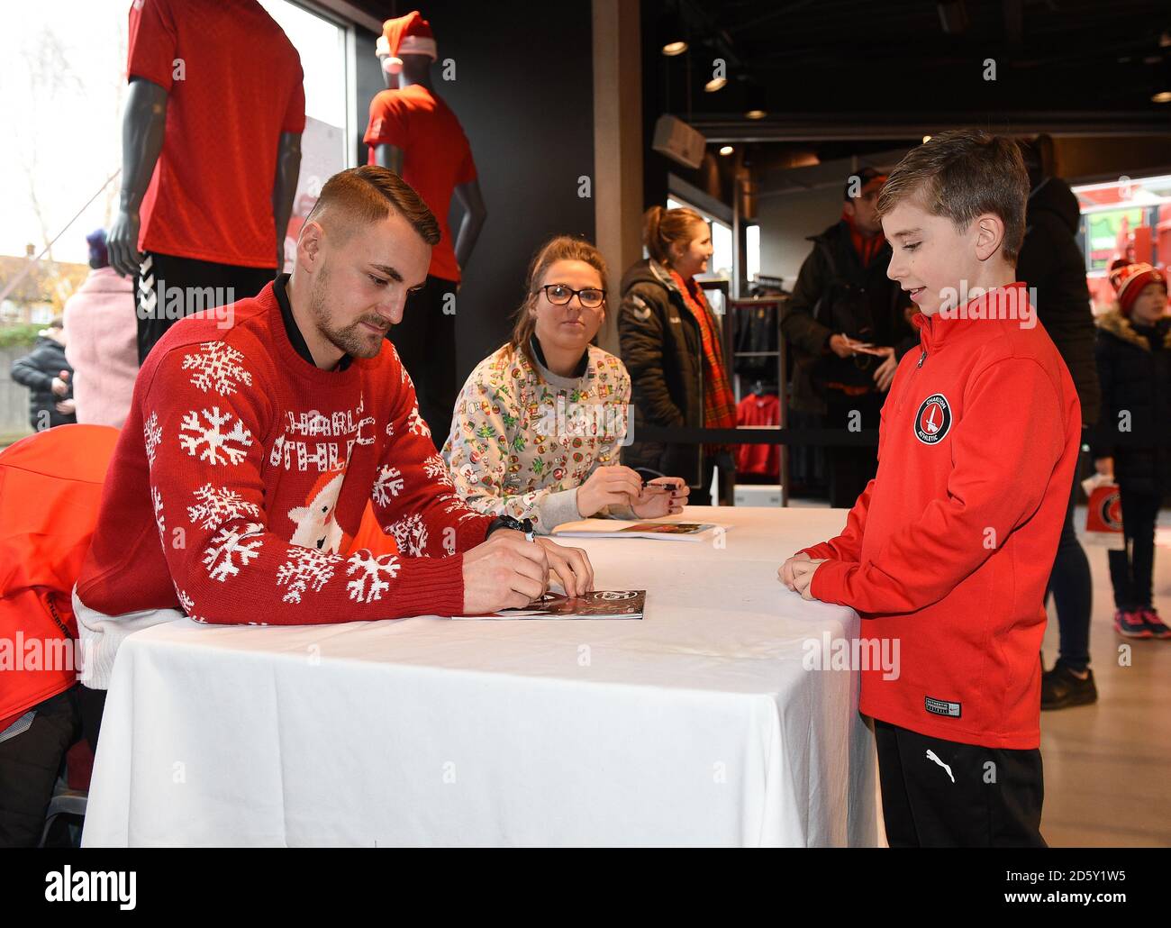 Charlton Athletic's Patrick Bauer signs a picture for a young fan in ...