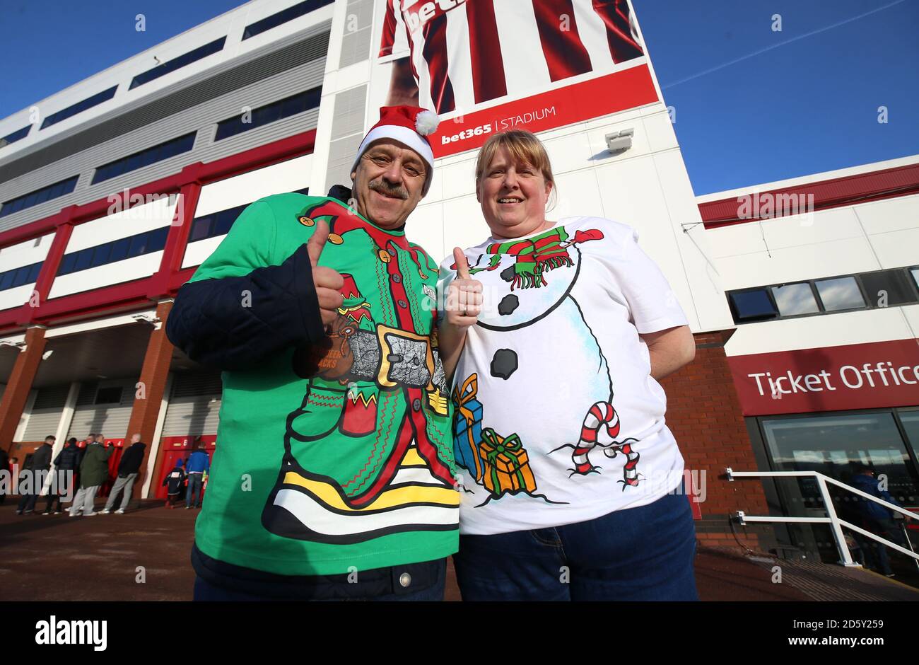 Fans pose for a picture outside the stadium prior to the match Stock ...