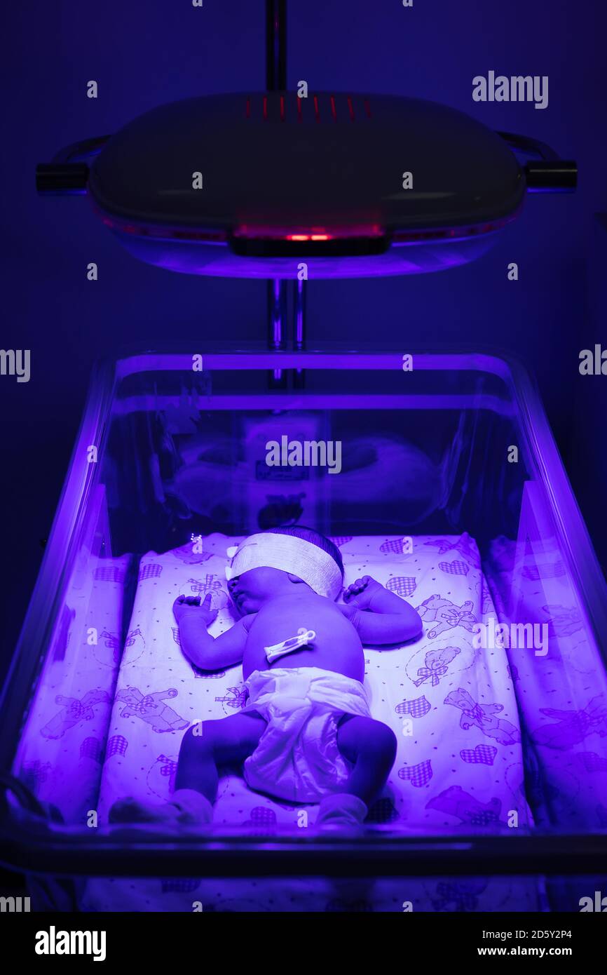 Newborn baby sleeping inside incubator hi-res stock photography and ...