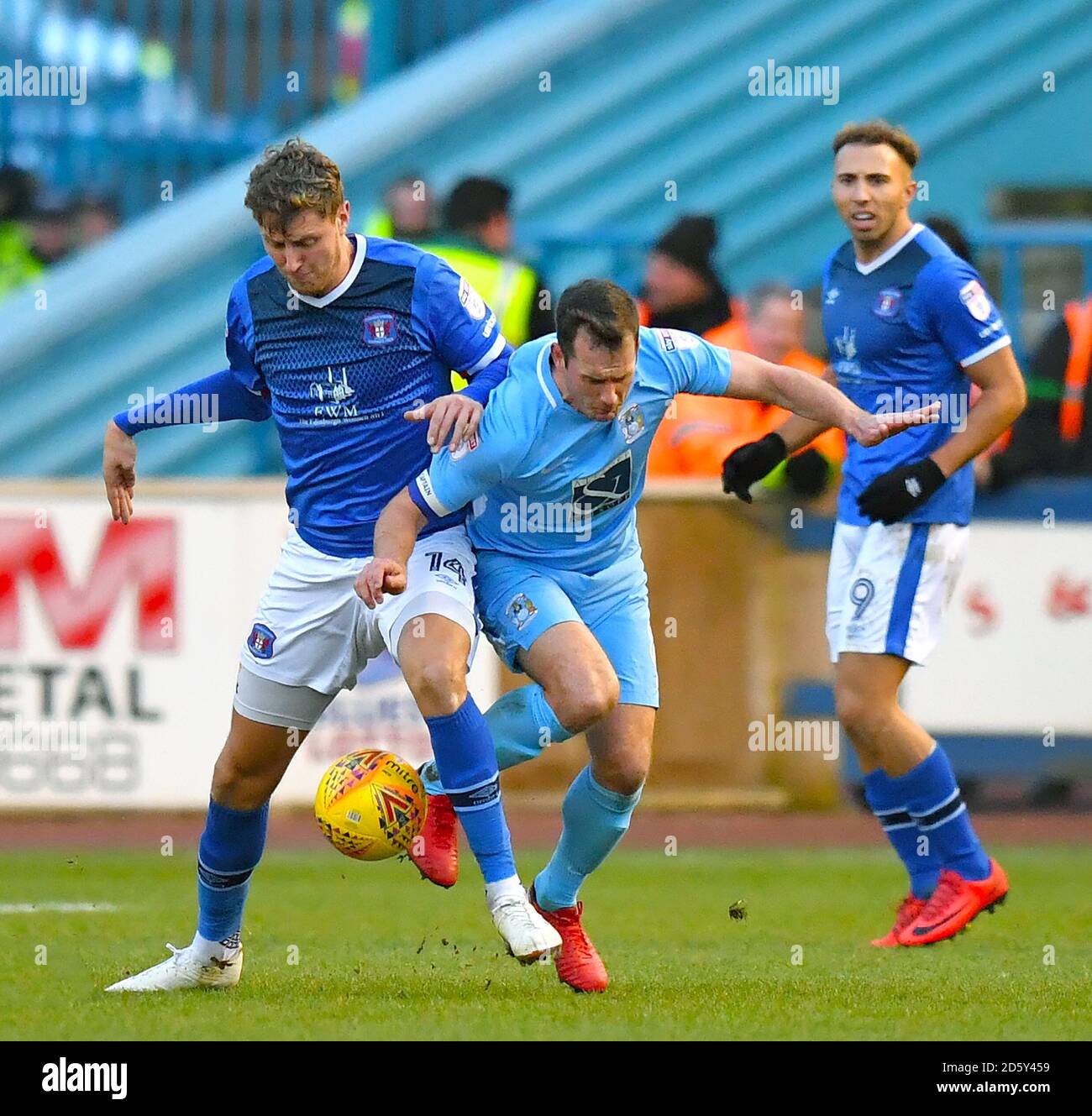 Coventry City's Michael Doyle battles with Carlisle United's Richard ...