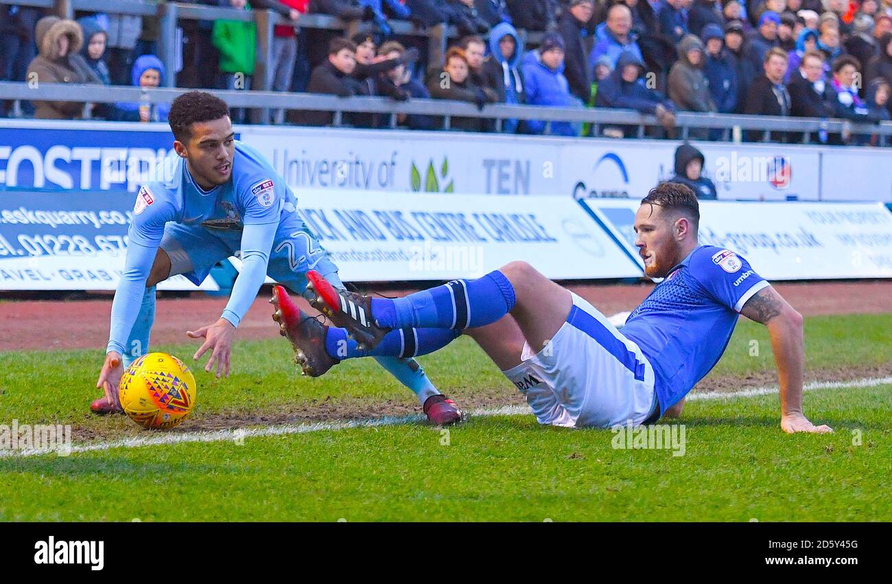 Coventry City's Devon Kelly-Evans battles with Carlisle United's Tom ...