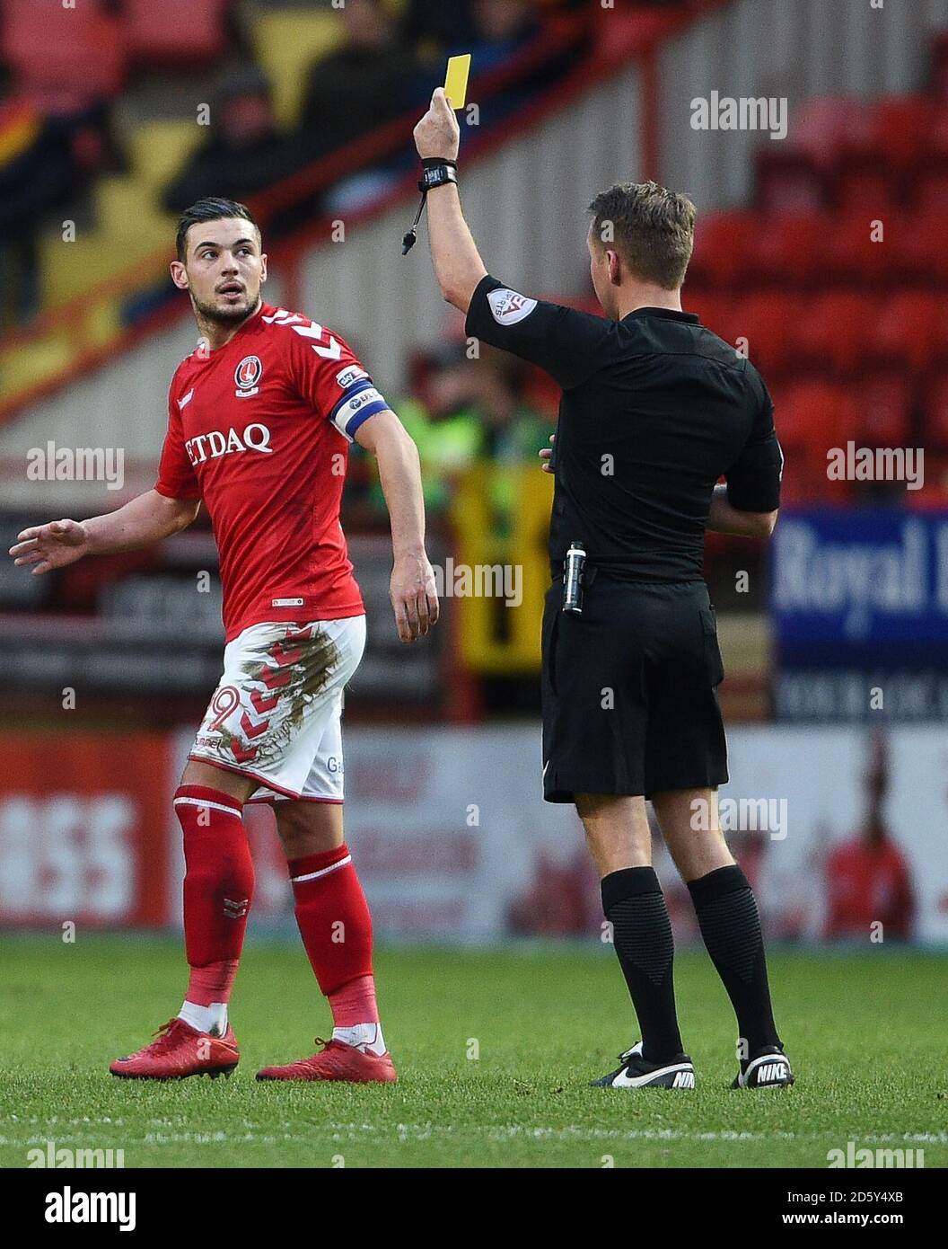 Charlton Athletic's Jake Forster-Caskey is booked by referee Oliver ...