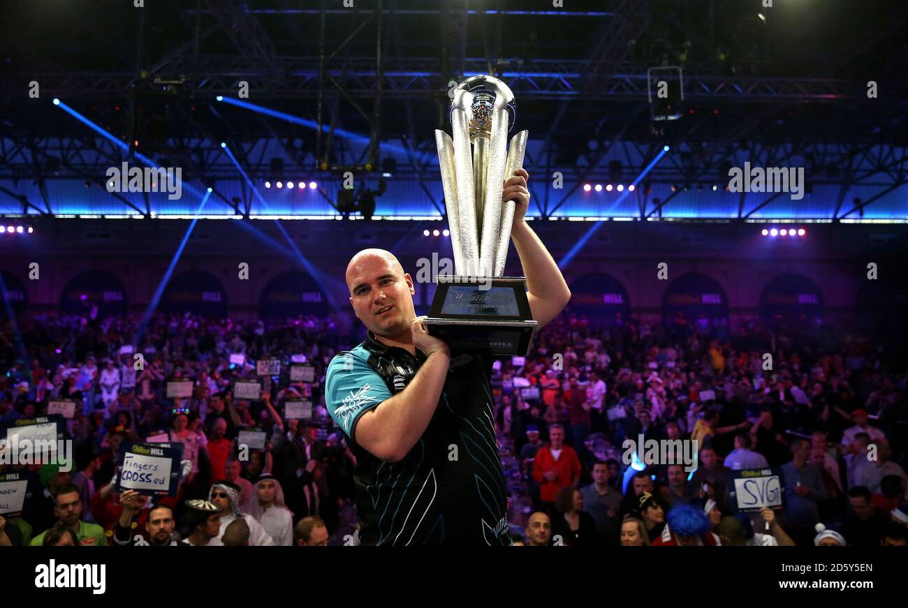 Rob Cross celebrates with the trophy after winning the final during day ...