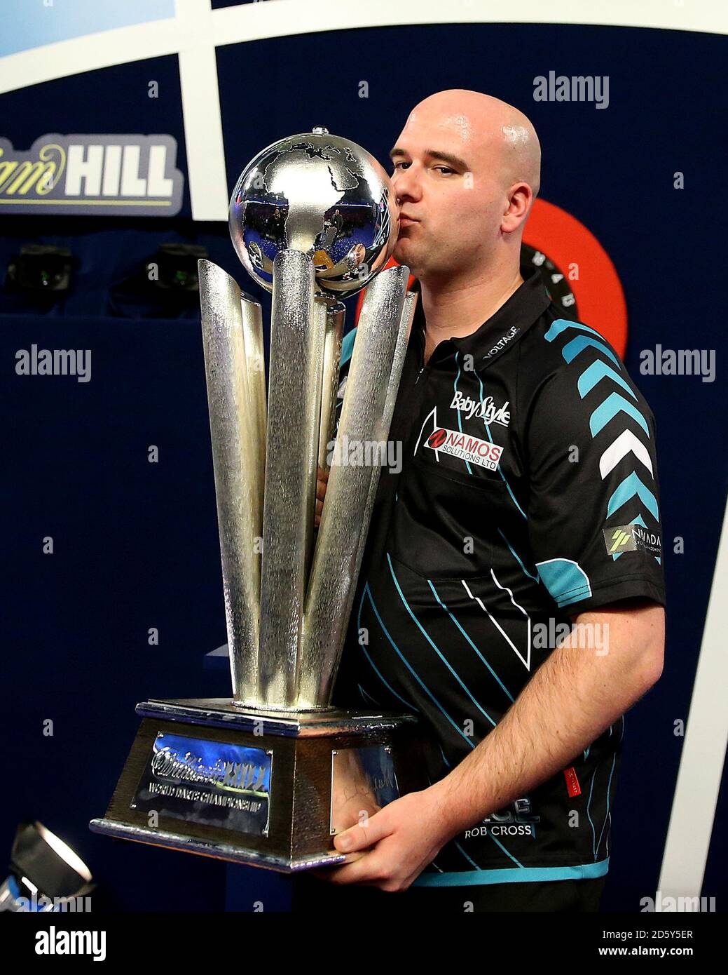 Rob Cross celebrates with the trophy after winning the final during day ...