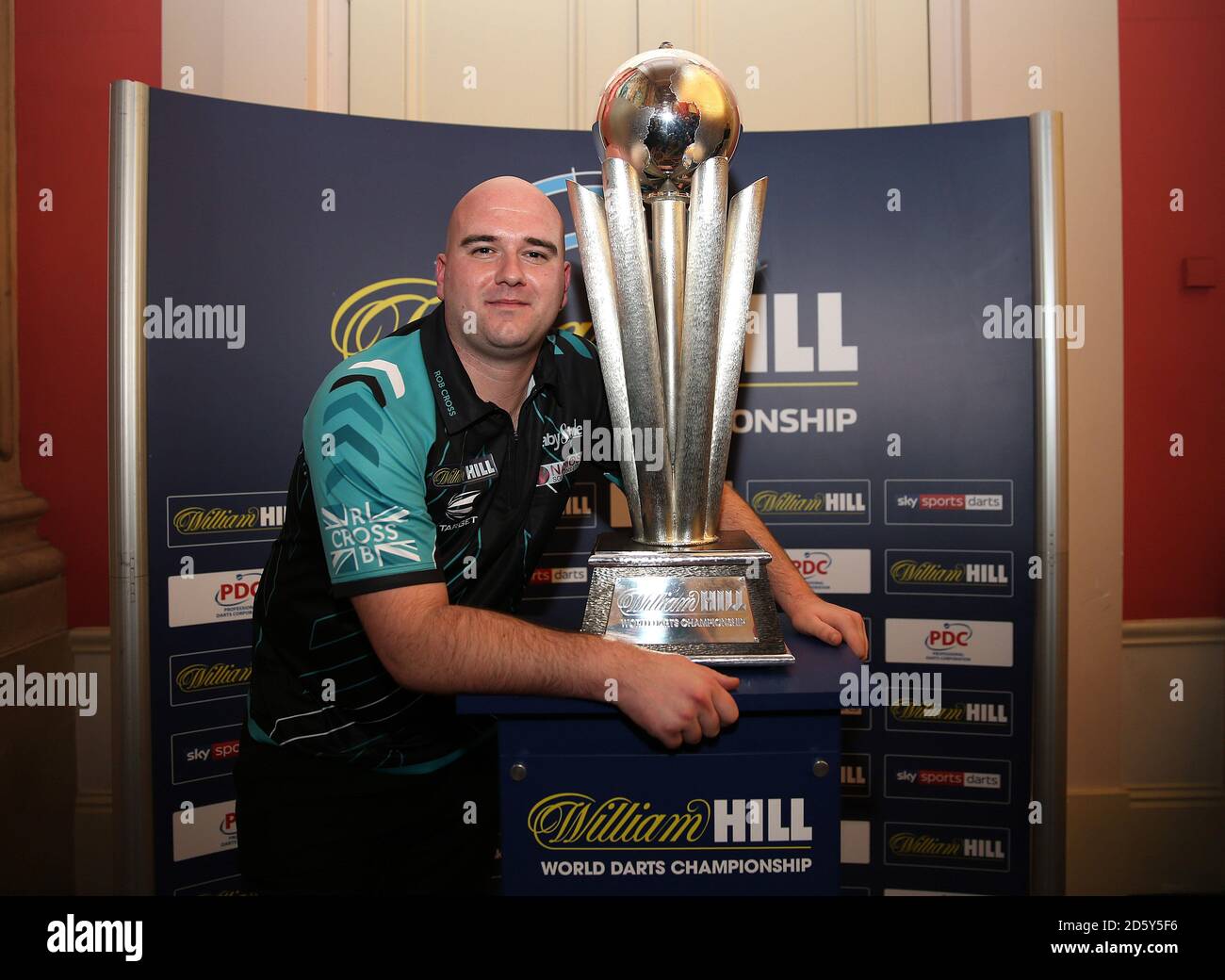 Rob Cross poses with the trophy during day fifteen of the William Hill ...
