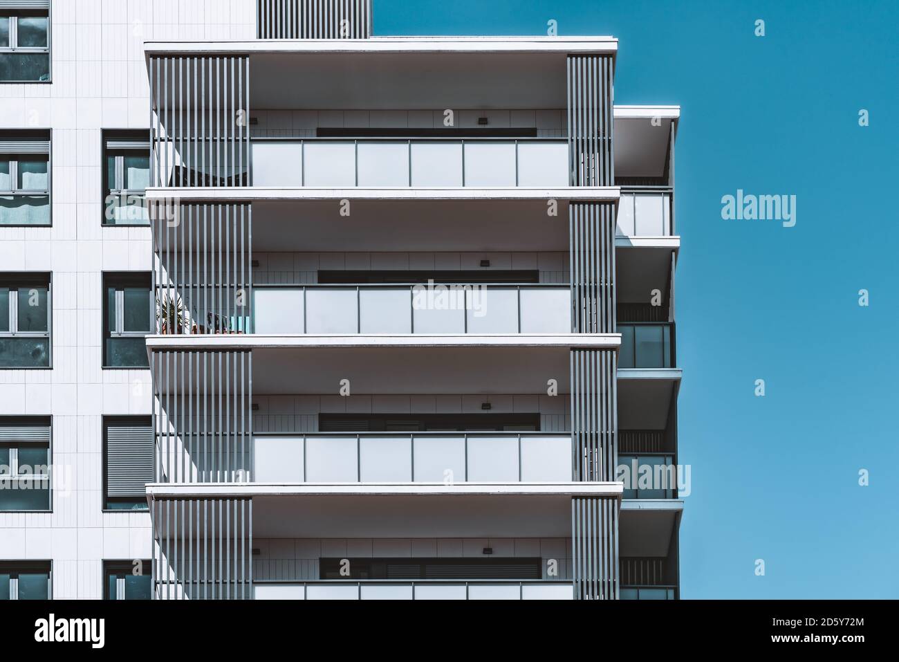 Windows and balconies of the upper floors of a contemporary residential ...